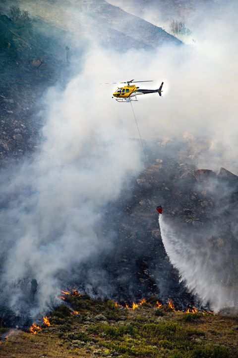 SNAPPED: Rescue crews hard at work during Saddle Butte fire
